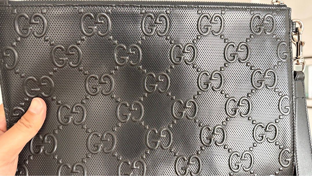 Gucci GG EMBOSSED POUCH, Women's Fashion, Bags & Wallets, Purses ...