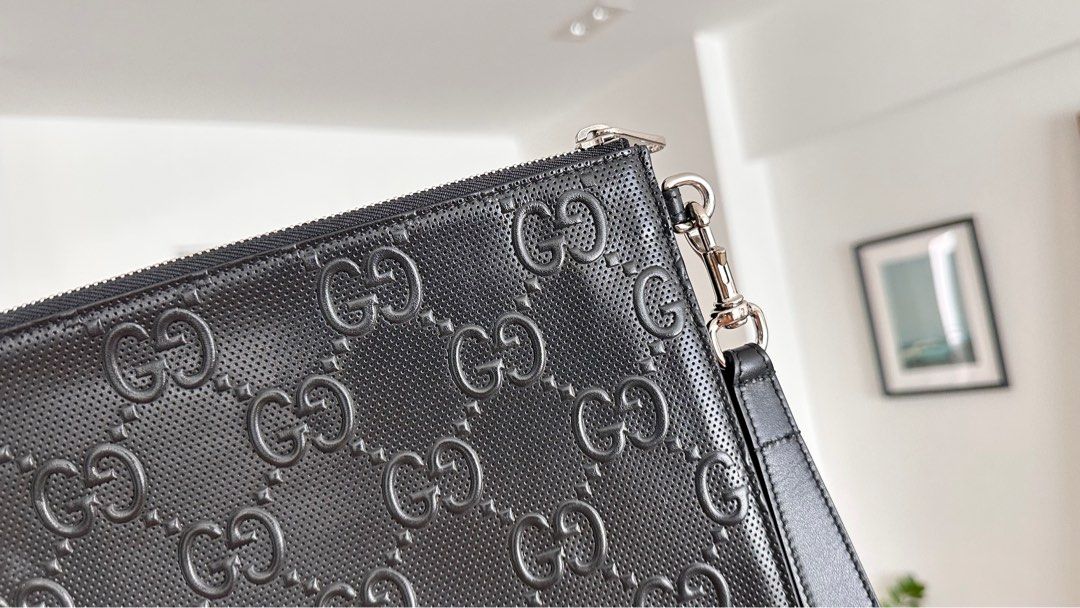Gucci GG EMBOSSED POUCH, Women's Fashion, Bags & Wallets, Purses ...