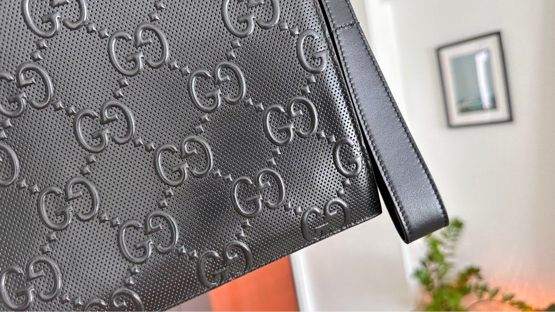 Gucci GG EMBOSSED POUCH, Women's Fashion, Bags & Wallets, Purses ...