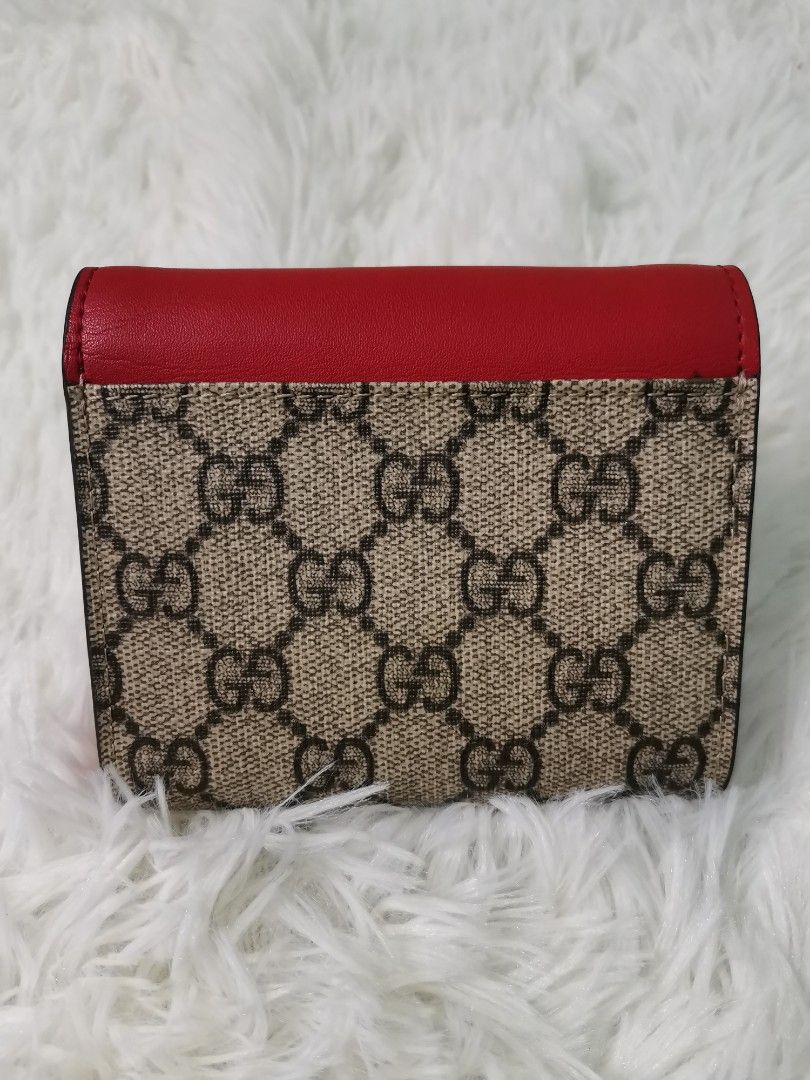 Gucci GG supreme tri-fold wallet coded on Carousell
