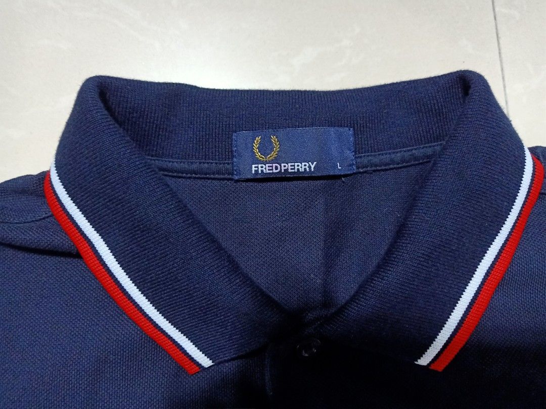 Original fred perry blue polo shirt for men on Carousell