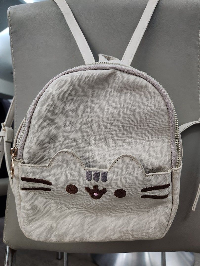 Typo Pusheen Backpack, Women's Fashion, Bags & Wallets, Backpacks on ...