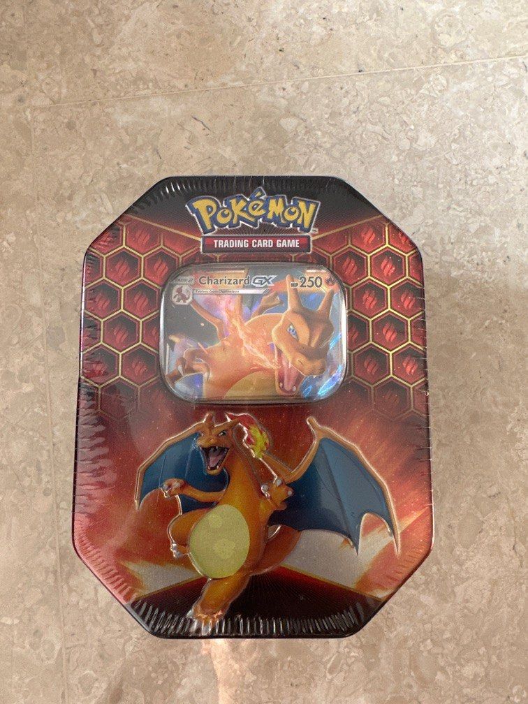 Charizard Tin Hidden Fates, Hobbies & Toys, Toys & Games on Carousell