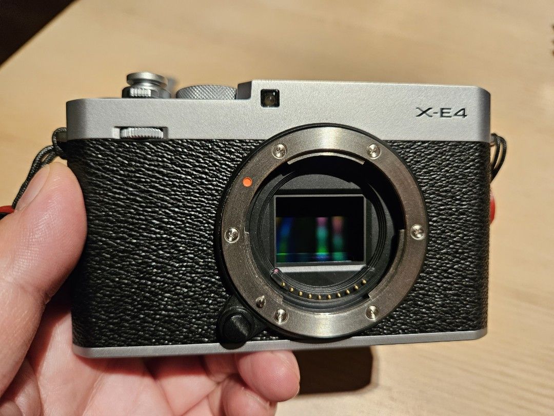 Fujifilm X-E4 (silver) w thumb rest & 2x grips, Photography, Cameras on Carousell