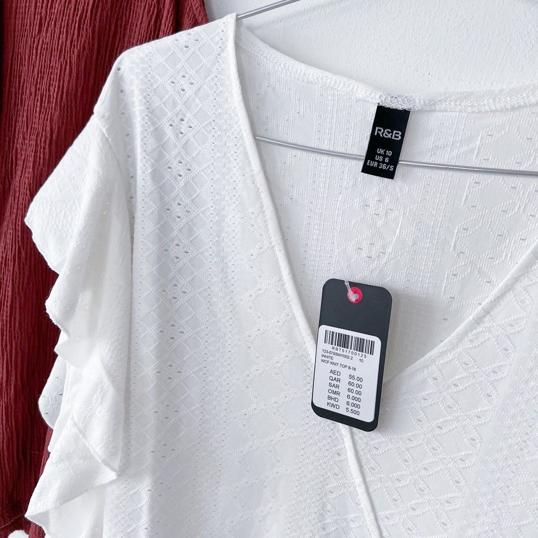 Sussans dark red top with mother of Pearl like big buttons. Sizing runs ...