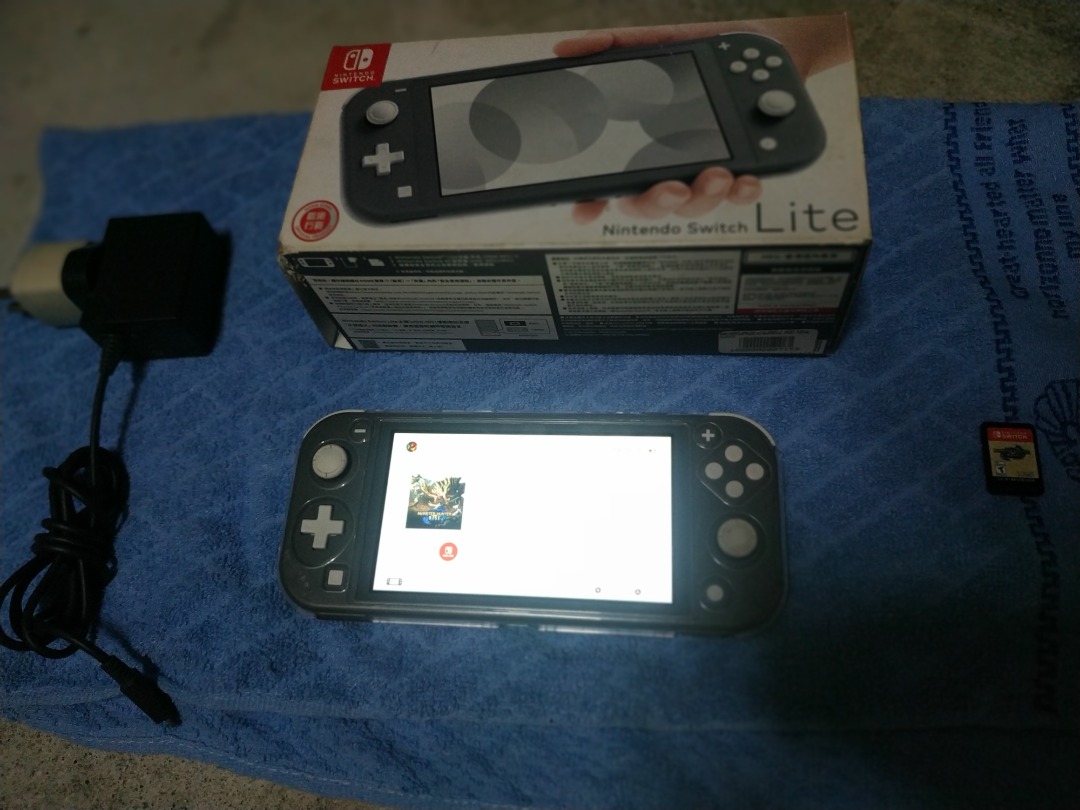 Nintendo Switch Lite with orig box and charger and free Mons. Hunter ...