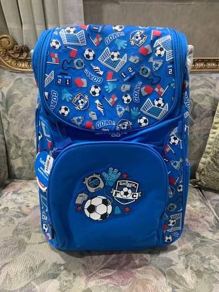 Authentic smiggle backpack soccer design on Carousell