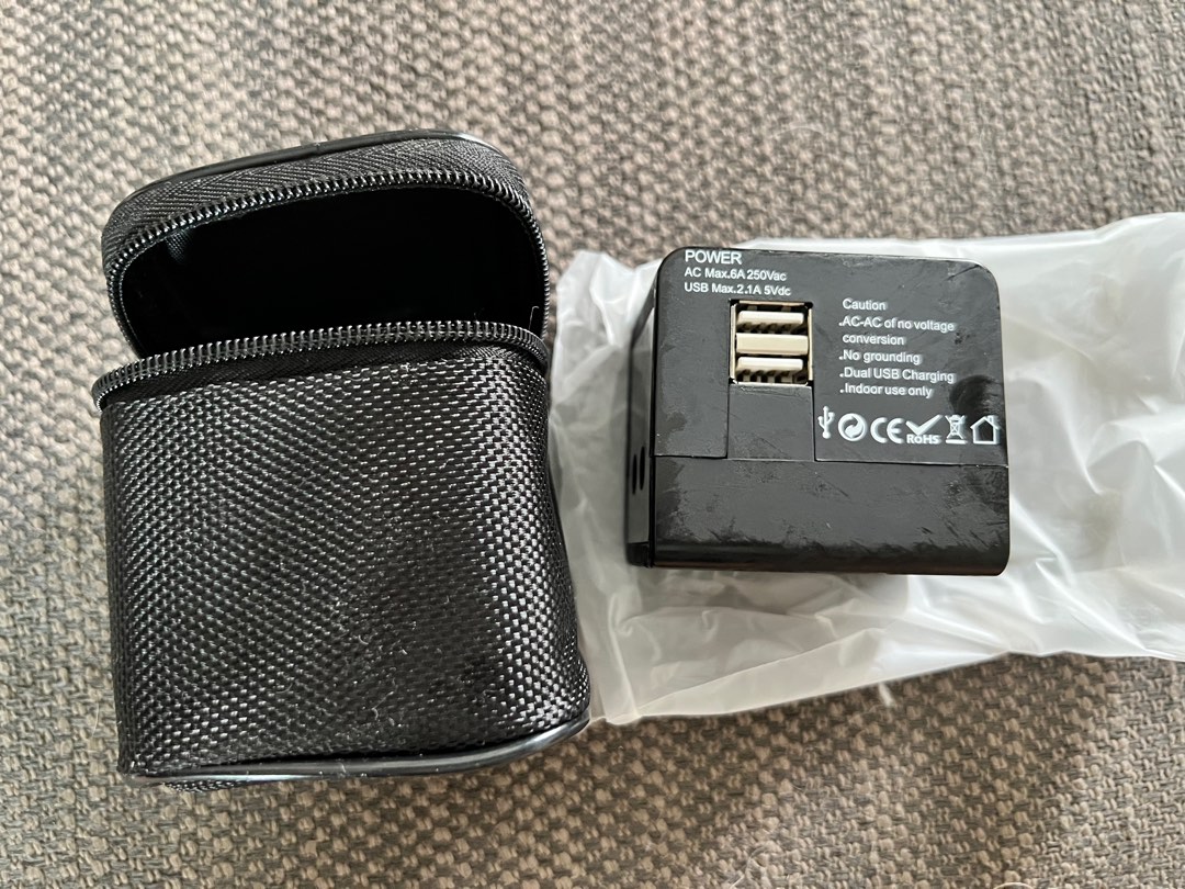 Universal travel adapter with 2 USB ports and storage pouch, Men's ...