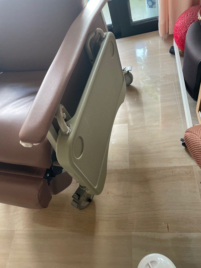 Electric geriatric reclining chair with table. Price not including ...