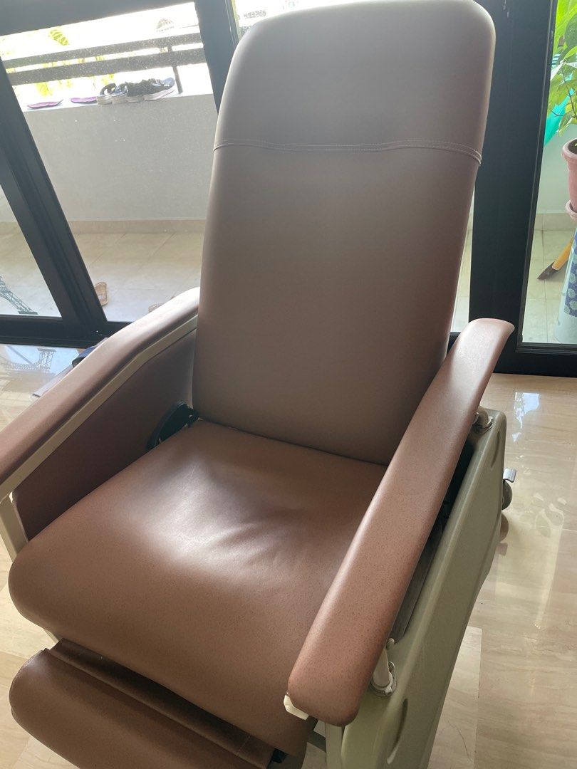 Electric geriatric reclining chair with table. Price not including ...