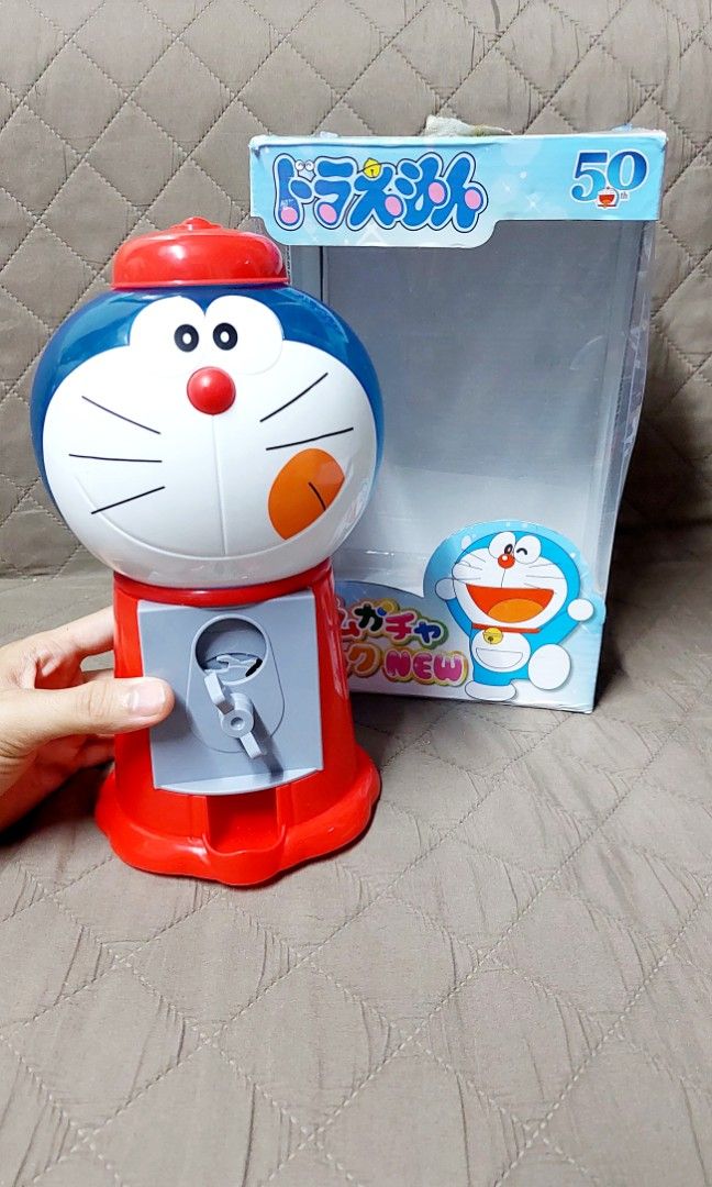 Doraemon candy coin dispenser, Hobbies & Toys, Toys & Games on Carousell