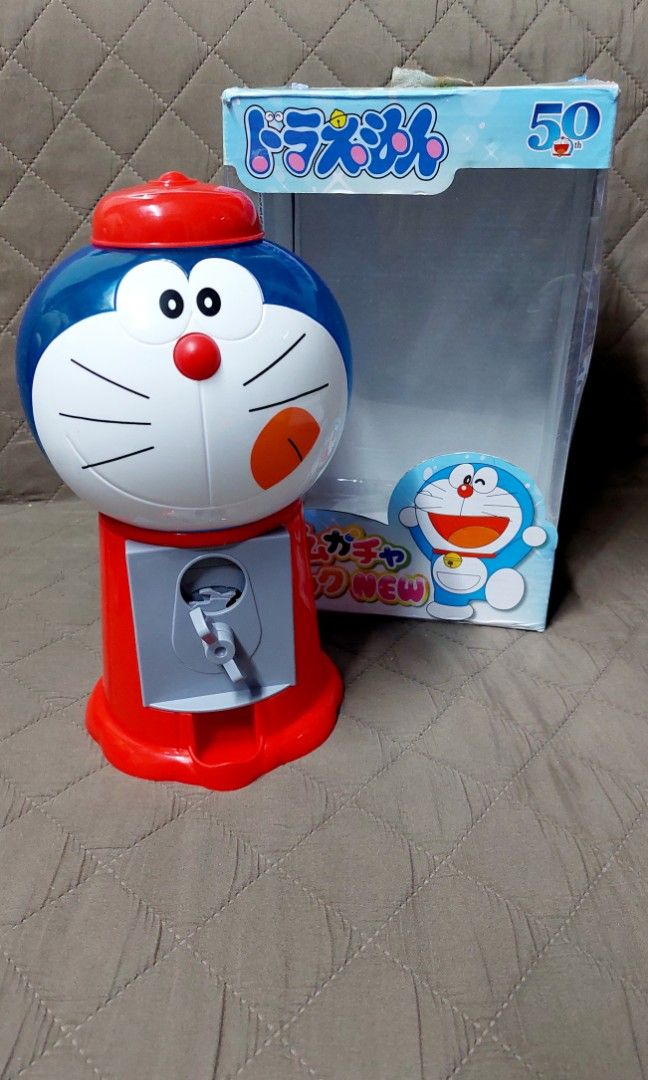 Doraemon candy coin dispenser, Hobbies & Toys, Toys & Games on Carousell