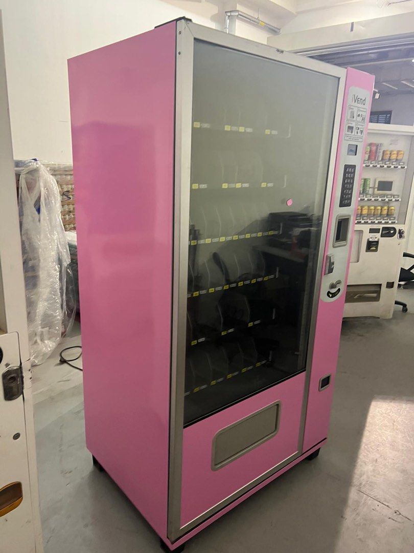 Vending machine wrapped with pink vinyl wrap, Everything Else on Carousell