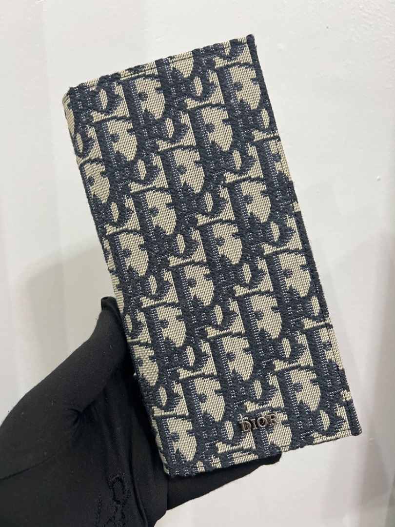 Dior vertical long wallet embroidered, Luxury, Bags & Wallets on Carousell