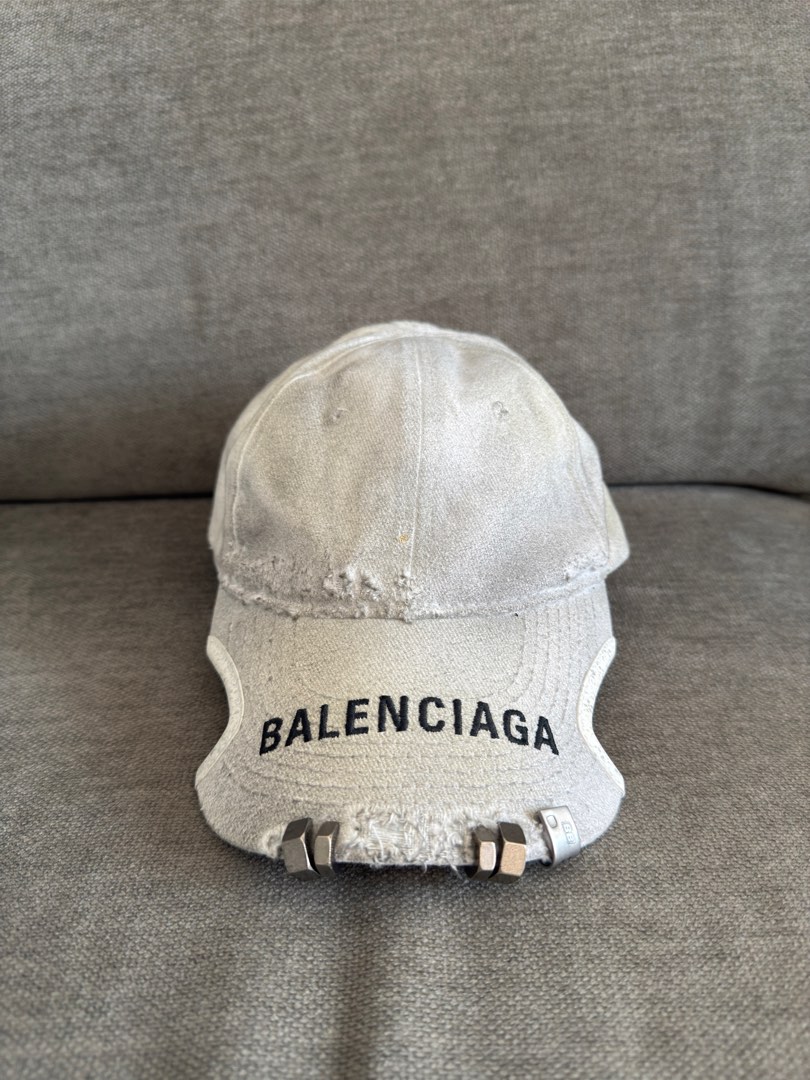 Balenciaga Distressed Piercing Logo Cap, 男裝, 手錶及配件, 棒球帽、帽 - Carousell