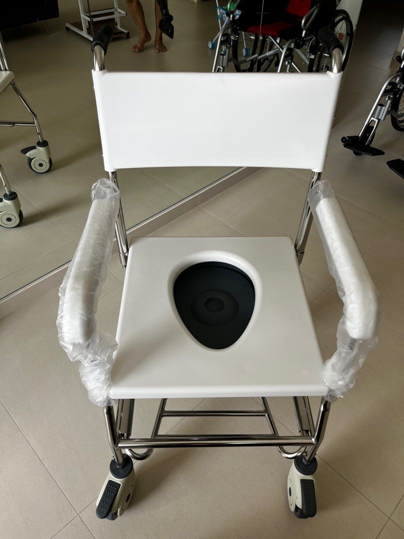 Brand new stainless steel deluxe commode with front anti-tipper, Health ...