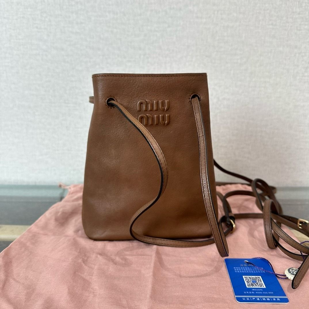 Miu Miu 24FW Logo Bucket Bag in Brown, Luxury, Bags & Wallets on Carousell