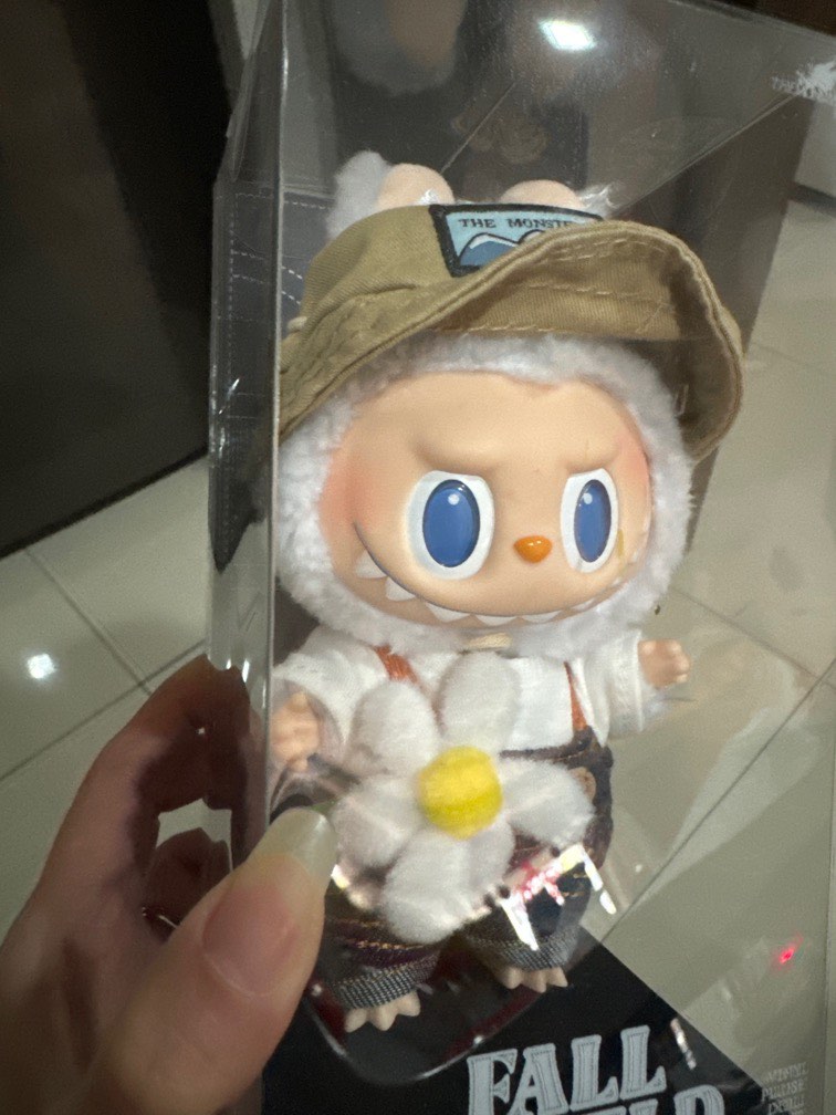 Popmart Labubu fall in wild pendant ( nose a bit off paint) official ...