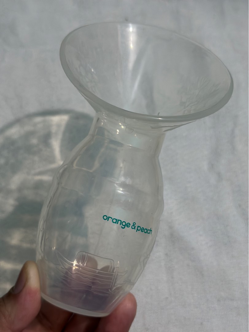 Orange ang peach milk catcher silicone pump, Babies & Kids, Nursing ...