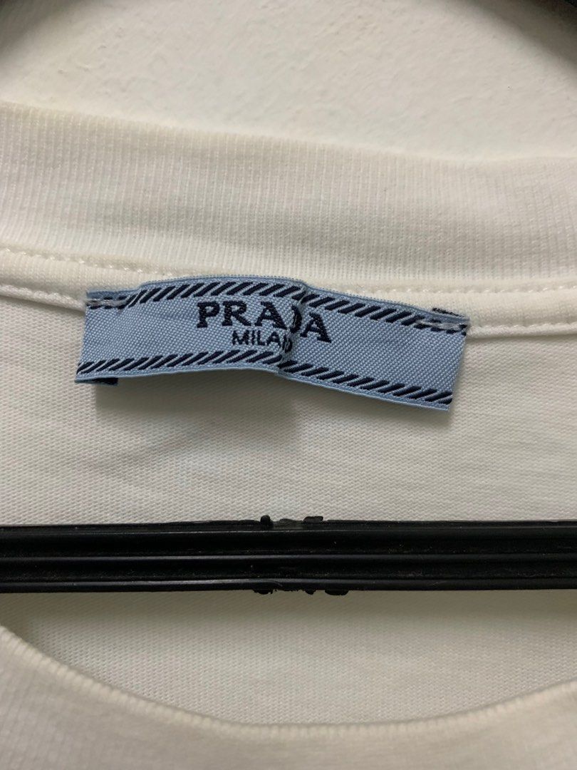 PRADA milano senter logo, Men's Fashion, Activewear on Carousell