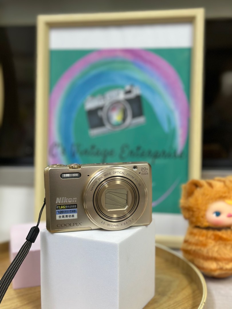 Nikon S7000 CCD gold, Photography, Cameras on Carousell