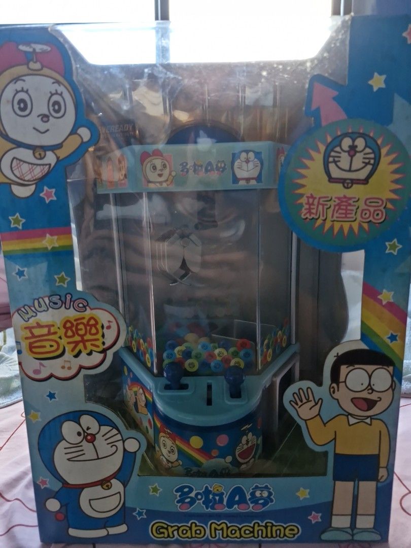Doraemon grab machine, Hobbies & Toys, Toys & Games on Carousell