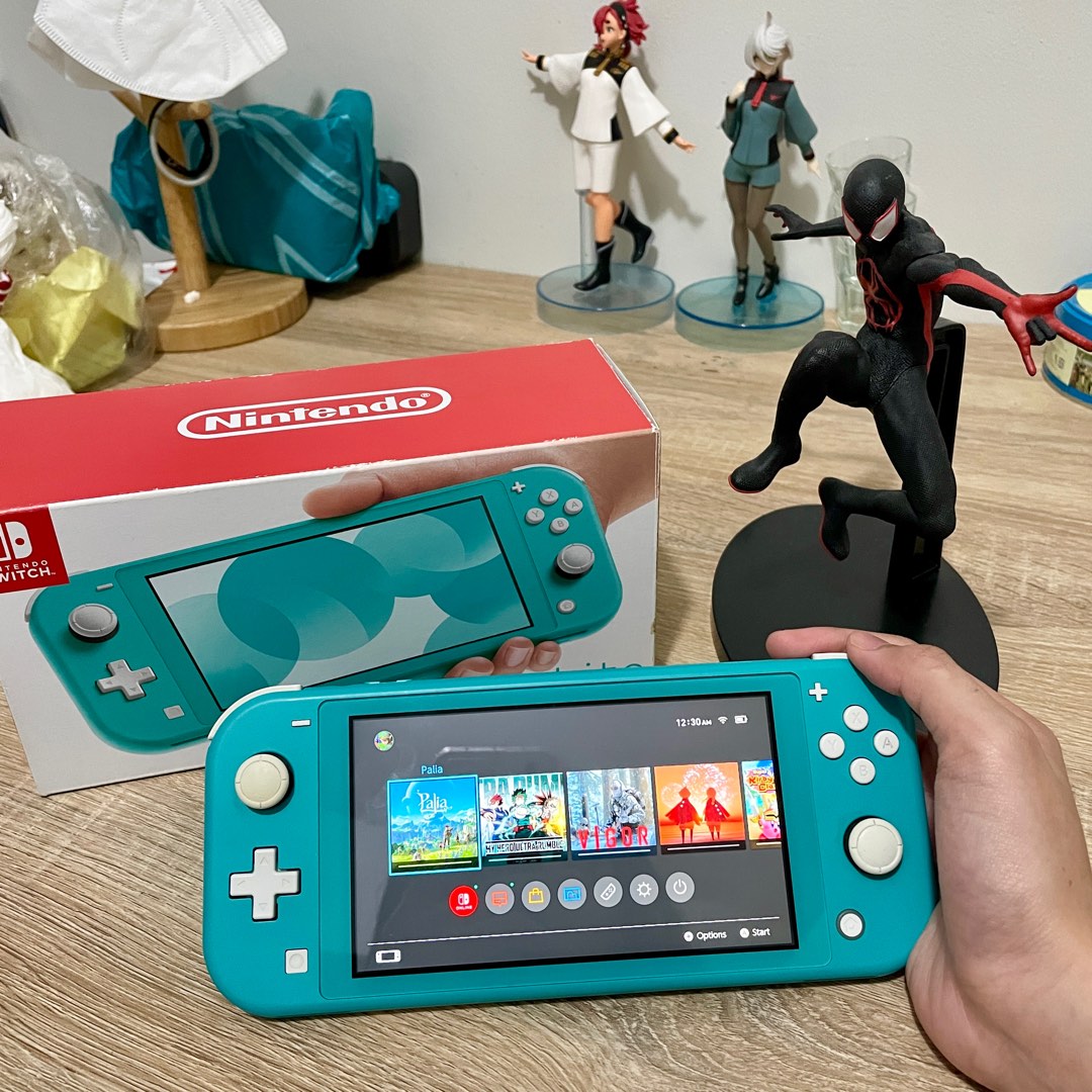Nintendo Switch Lite (Turquoise) Complete with Box and 14 Digital Games ...
