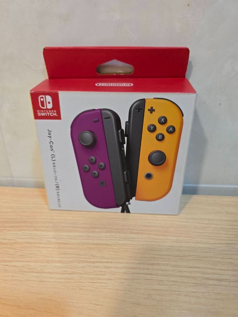 【Nintendo 任天堂】二手 NS Switch Joy-con Joycon 原廠 左右手把 電光紫 電光橘 紫橘 9成新, 電玩遊戲相關, 主機配件與周邊商品, 手把控制器在旋轉拍賣