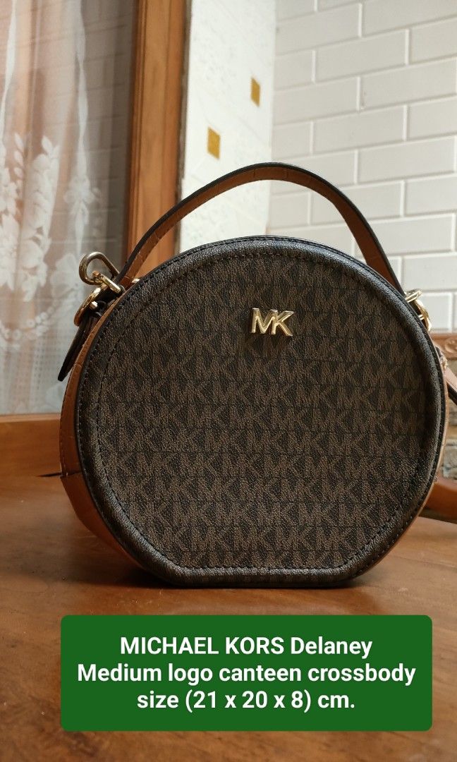 MK Delaney Medium logo canteen crossbody, Fesyen Wanita, Tas & Dompet di Carousell