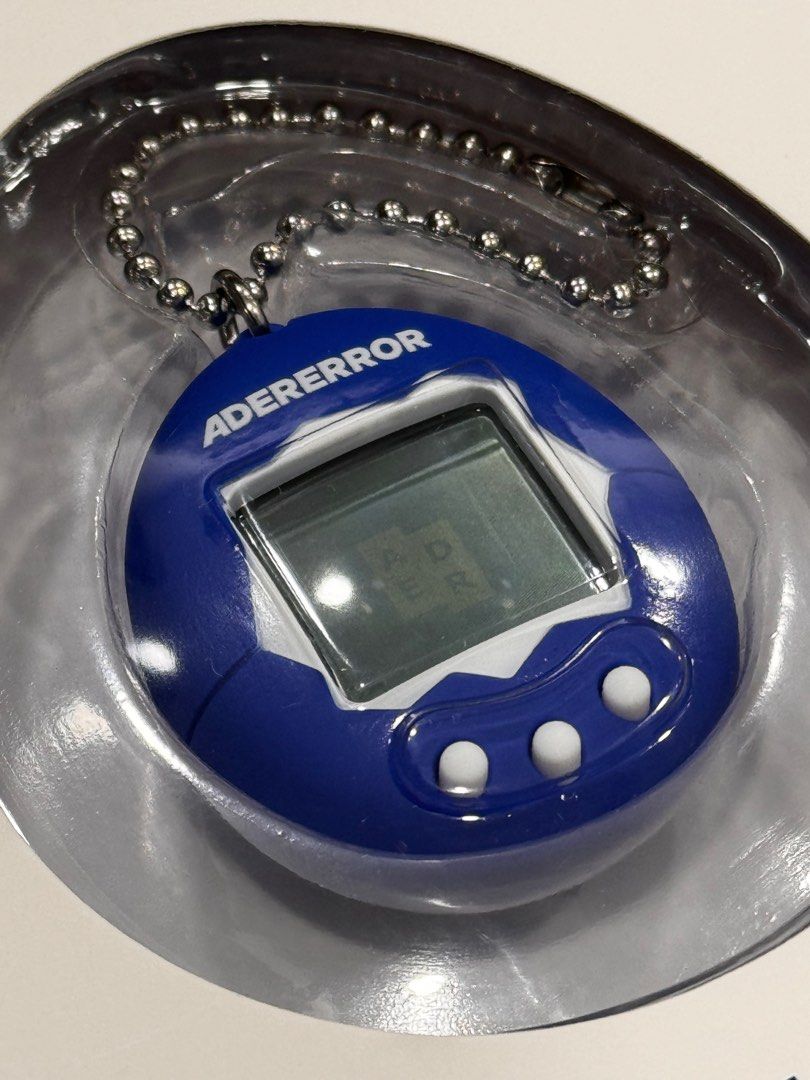 ADERERROR X TAMAGOTCHI, Hobbies & Toys, Toys & Games on Carousell