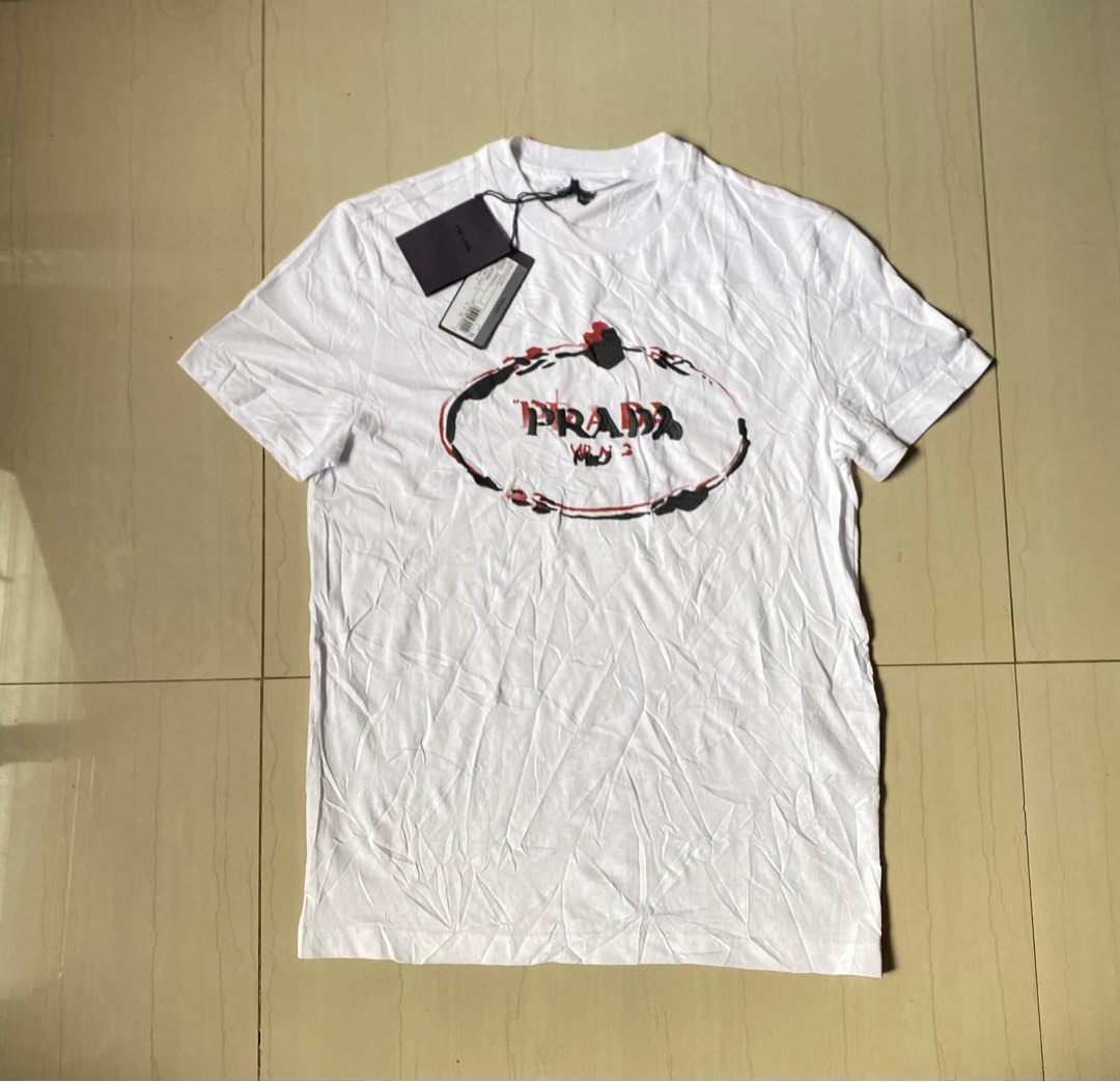 Prada authentic embriod logo, Men's Fashion, Tops & Sets, Tshirts & Polo Shirts on Carousell