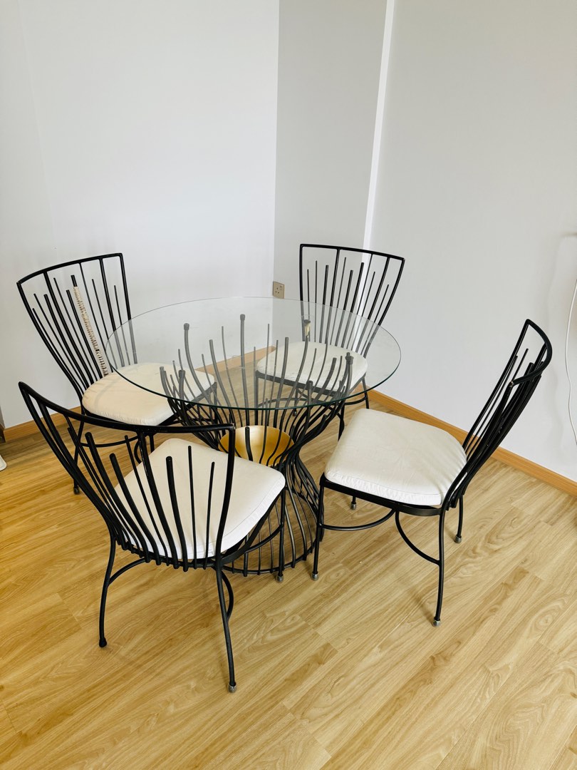 Designer round glass top iron table with 4 solid iron chairs , glass ...