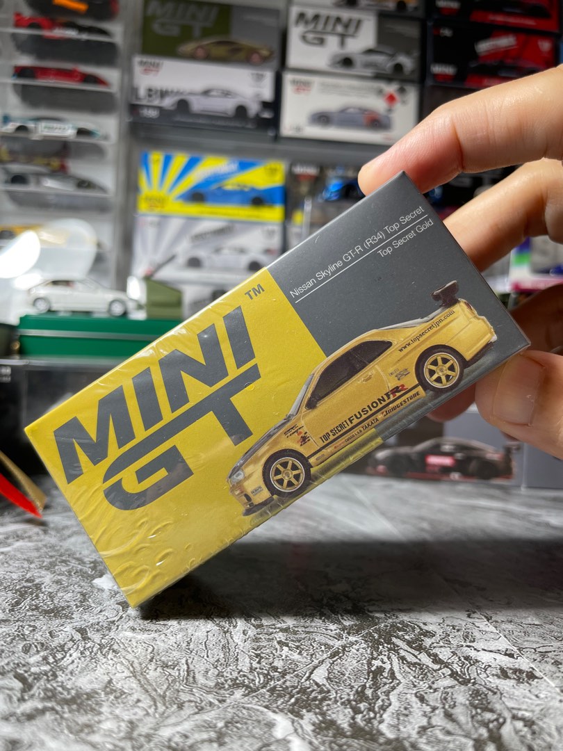 Mini gt #676 GTR R34 top secret gold, Hobbies & Toys, Toys & Games on ...