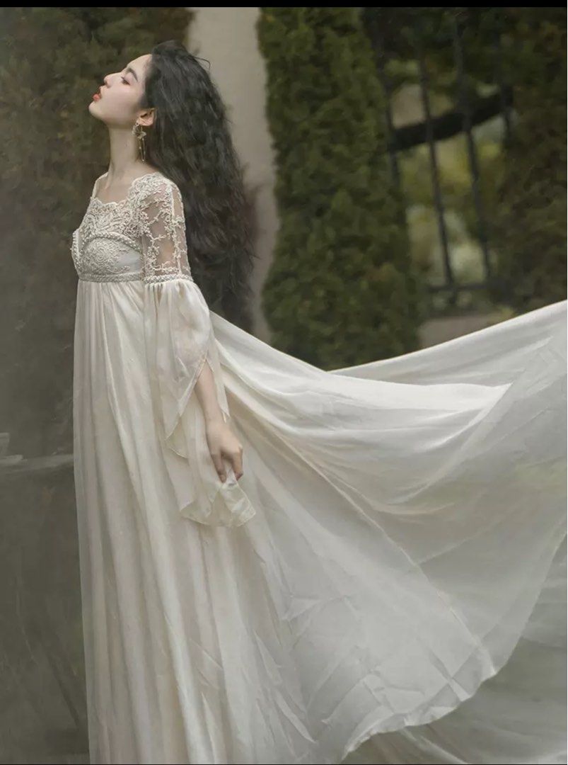 Roman Style Wedding Dresses The Bride In A Long Dress Stands Near