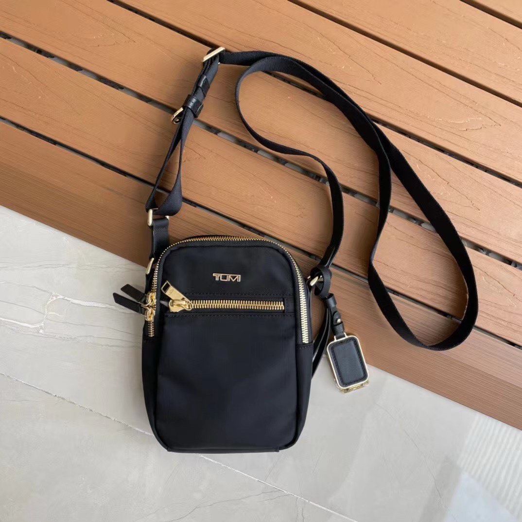 Tumi mini sling crossbody bag hand bag, Luxury, Bags & Wallets on Carousell