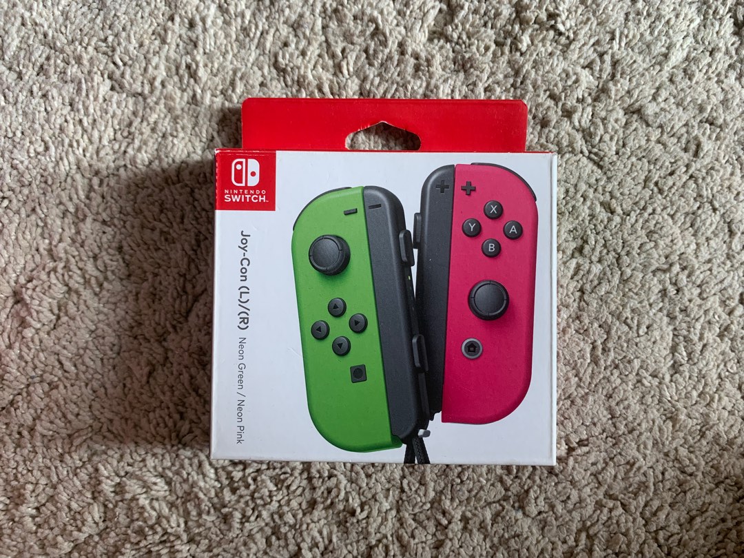 99% Like NEW Neon Green and Neon Pink Joycons, come with straps and box ...