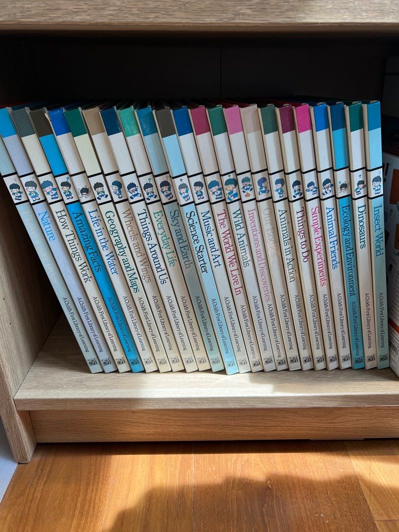 young students learning library encyclopedia