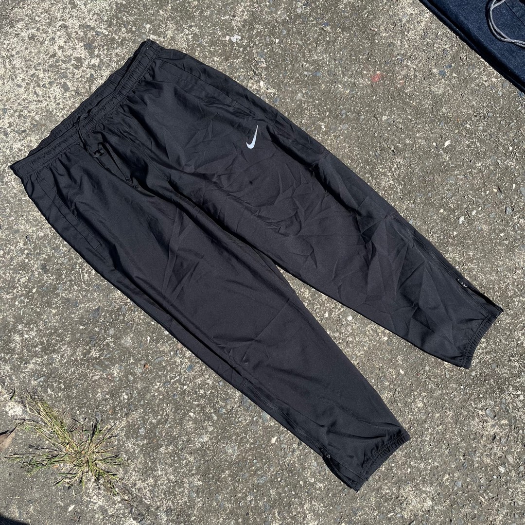 Nike Track ankle zip pants, Men's Fashion, Bottoms, Joggers on Carousell