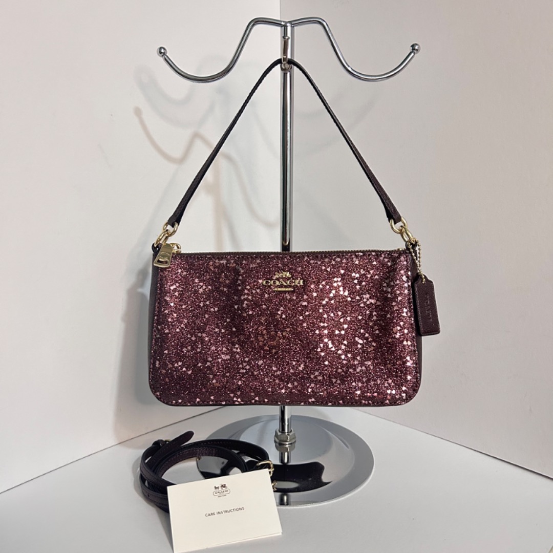 Coach top handle pouch with heart glitters, Luxury, Bags & Wallets on ...