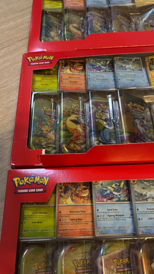 Prismatic Evolutions 8 Pack Mini tins Costco Exclusive, Hobbies & Toys ...