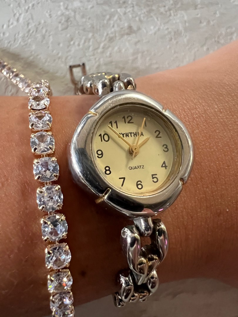 Cynthia Krone brand quartz watch with a silver-tone case and a small ...