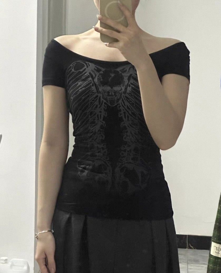 black skull skeleton graphic top with back cutouts and backbone style ...
