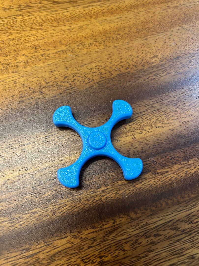 Blue Cross-Shaped Fidget Spinner, Hobbies & Toys, Toys & Games on Carousell