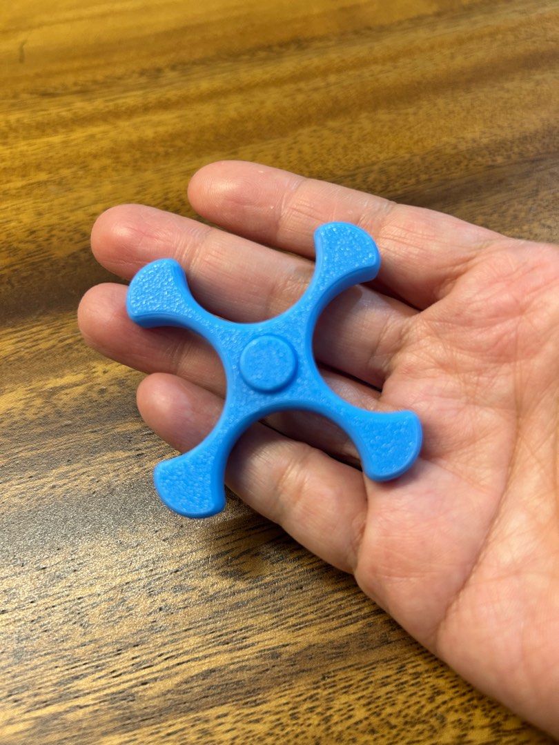 Blue Cross-Shaped Fidget Spinner, Hobbies & Toys, Toys & Games on Carousell