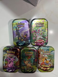 Prismatic Evolution Tins, Hobbies & Toys, Toys & Games on Carousell