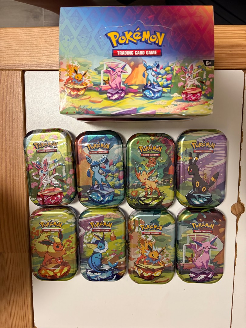 Prismatic Evolution Tins, Hobbies & Toys, Toys & Games on Carousell
