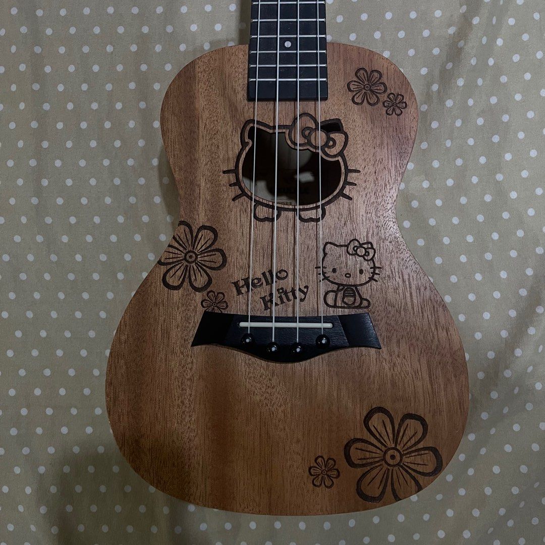 hello kitty wood carve ukulele, Hobbies & Toys, Music & Media, Musical Instruments on Carousell