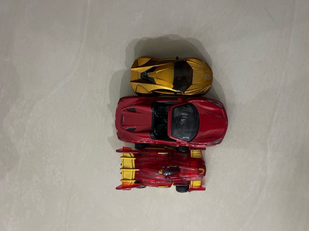 Toy cars, the ones on the left and right can transform, the middle is ...