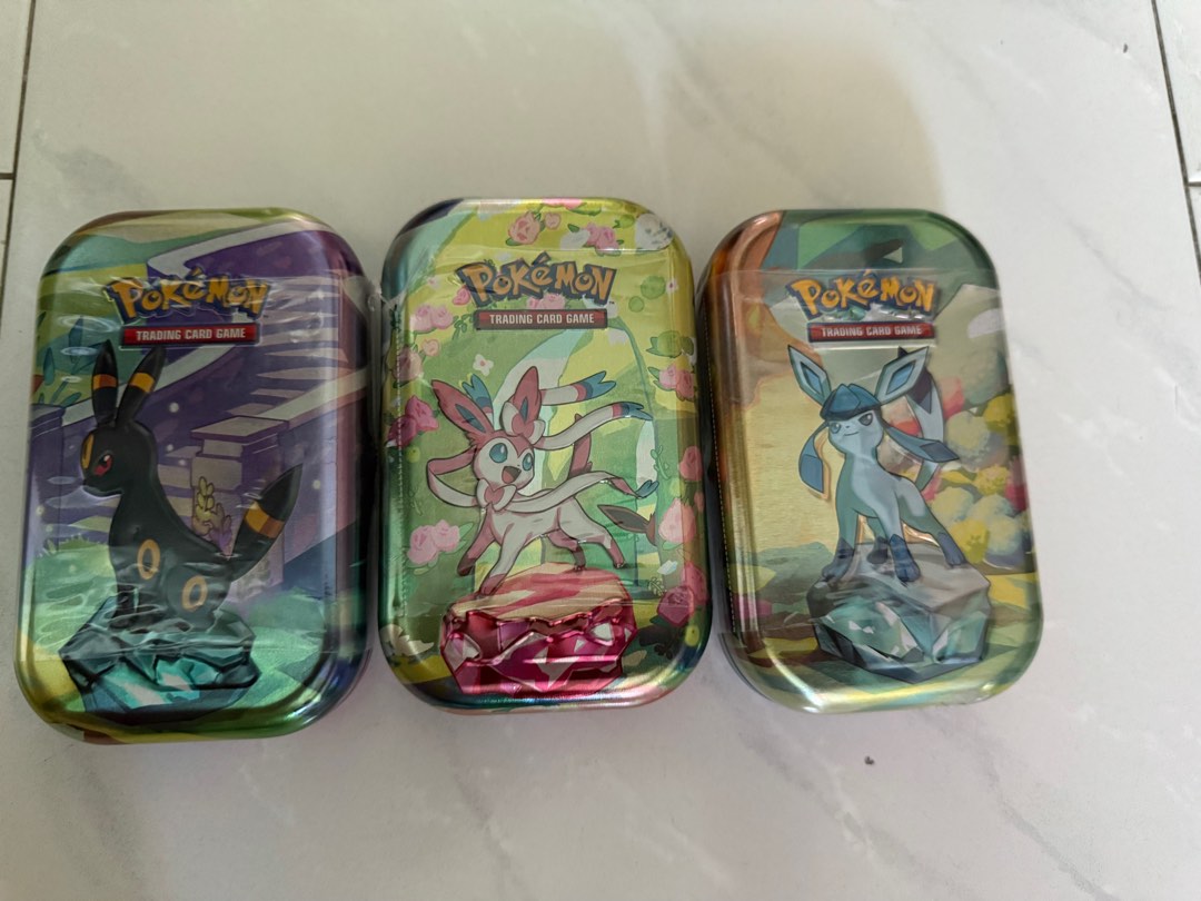 Prismatic evolution tins, Hobbies & Toys, Toys & Games on Carousell