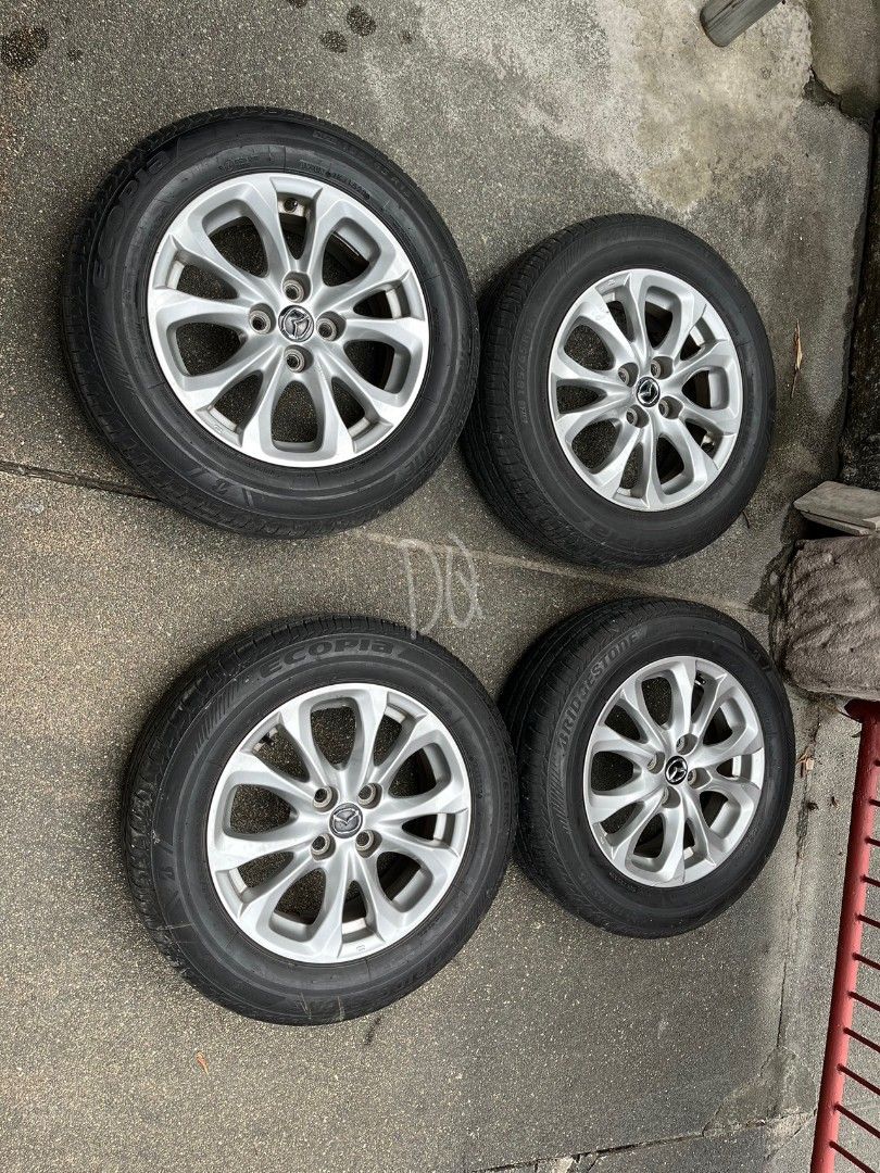 Mazda 2 15s Stock Mags with Bridgestone 185-65-15 tires, Car Parts ...